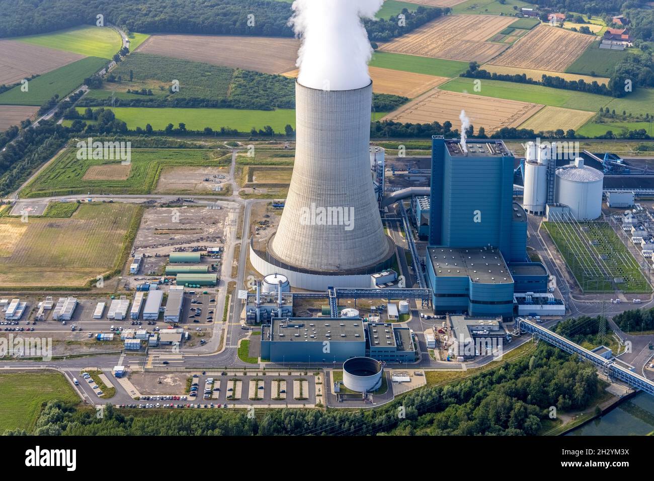 Aerial view of the power plant facilities and exhaust towers of the ...