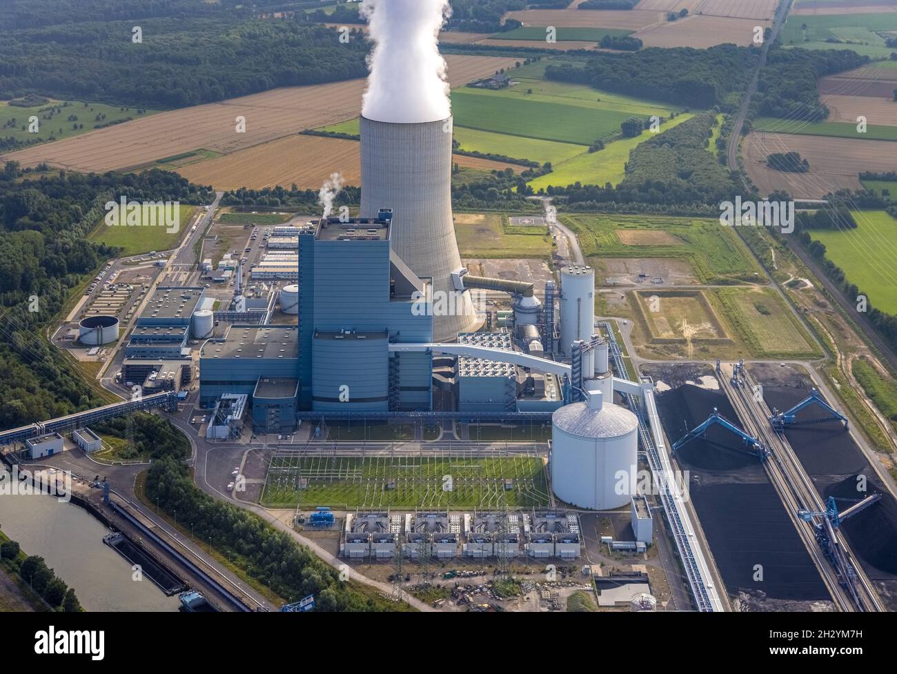 Aerial view of the power plant facilities and exhaust towers of the ...