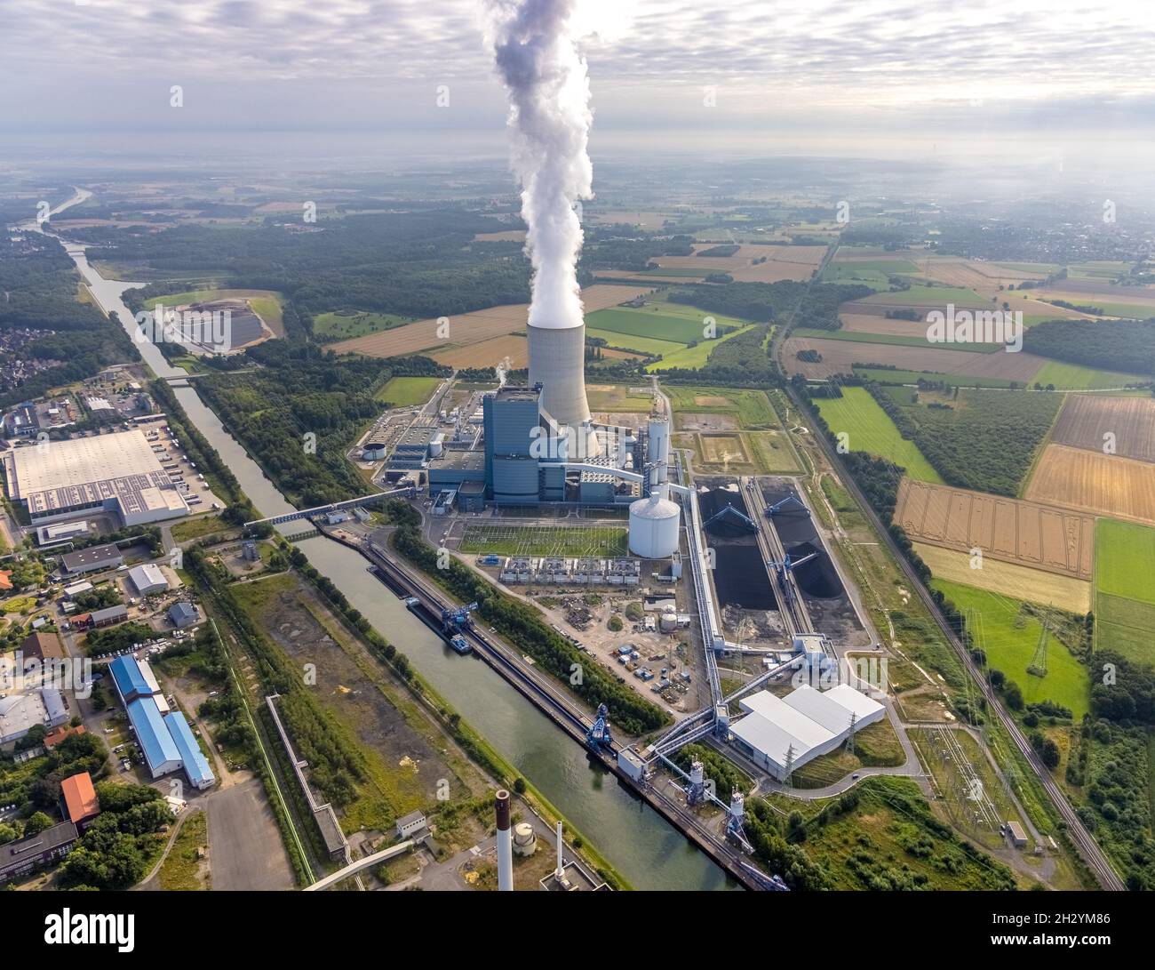 Aerial view of the power plant facilities and exhaust towers of the ...