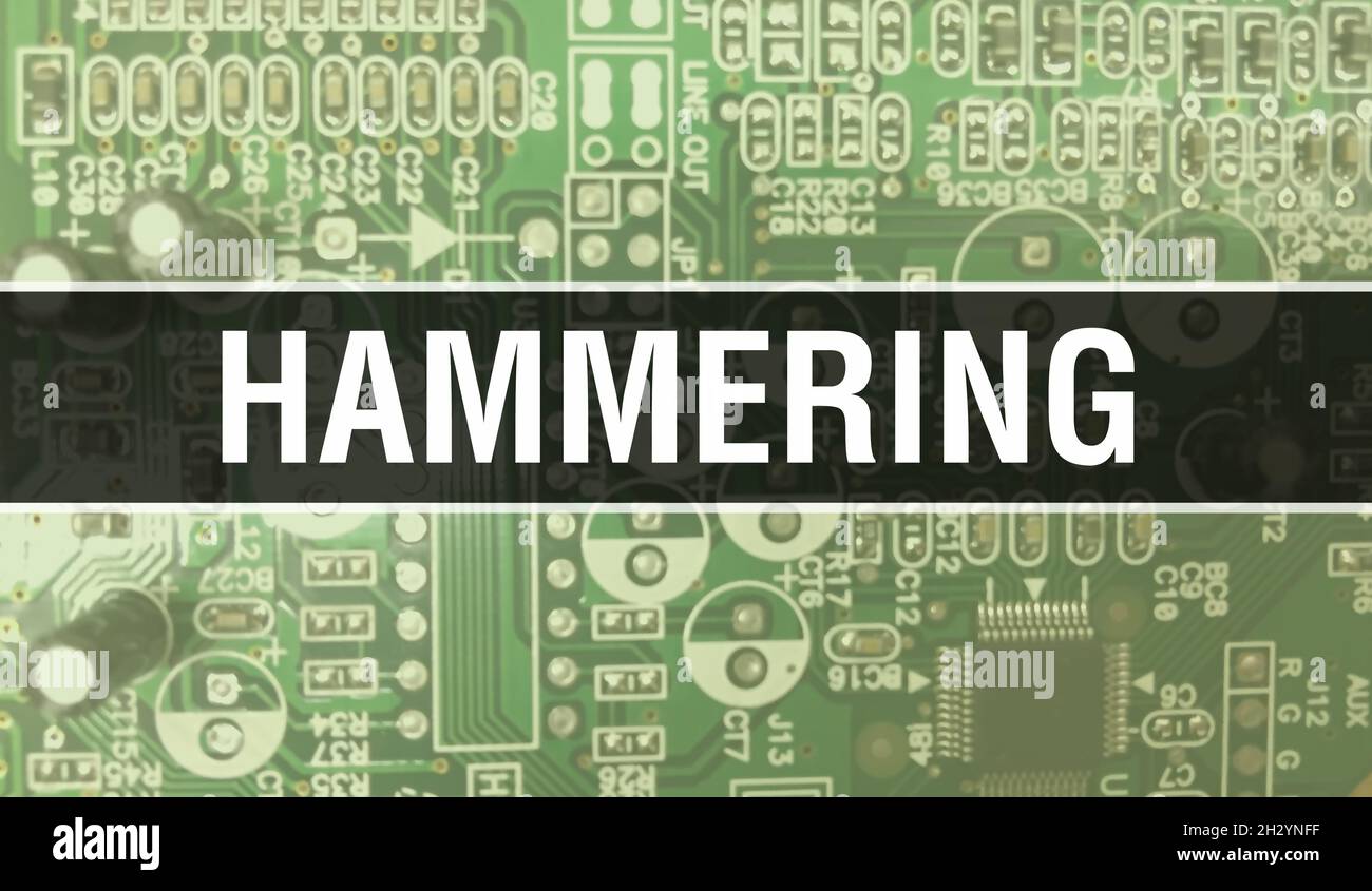 Hammering concept with Computer motherboard. Hammering text written on ...