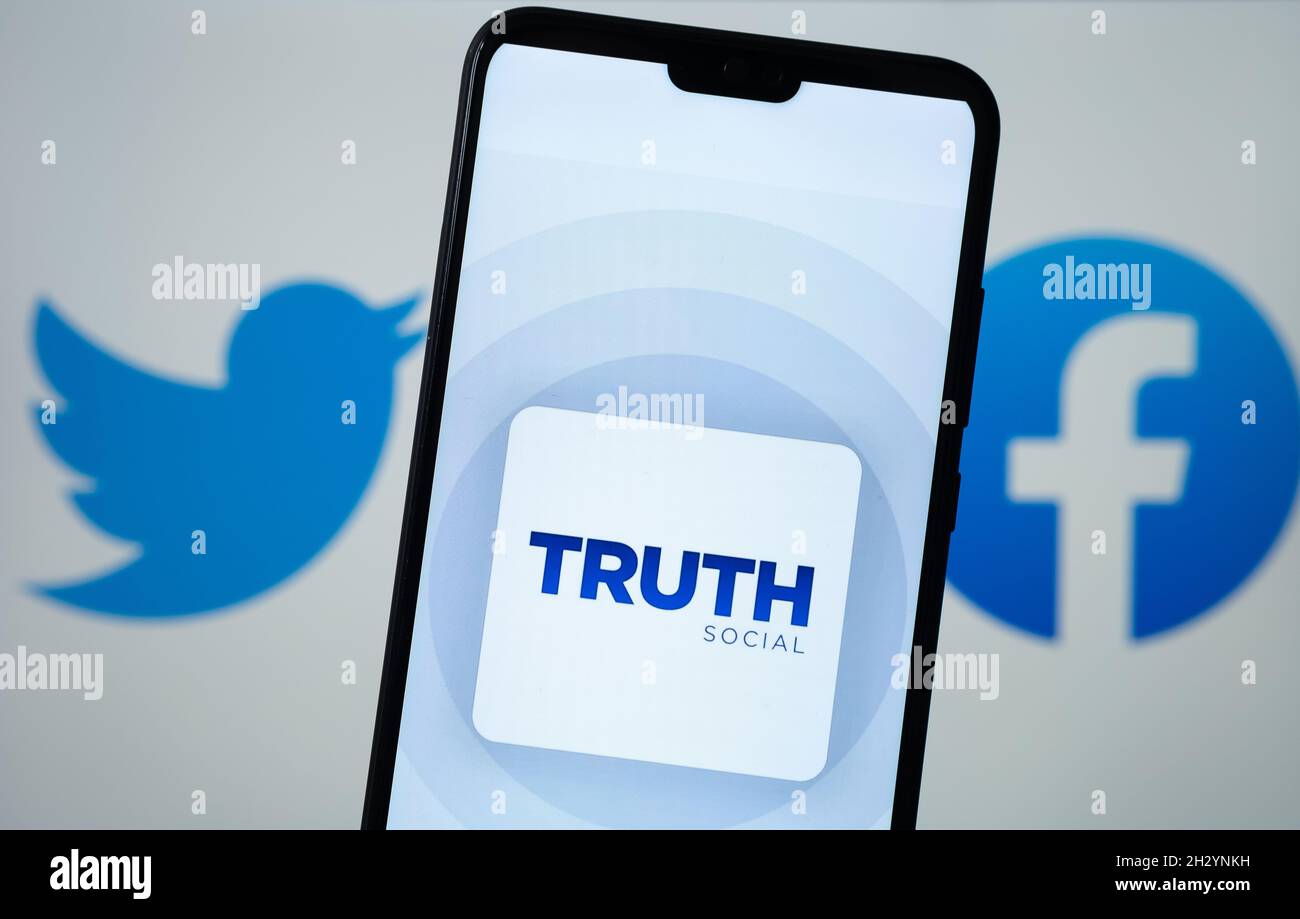 Truth Social app logo seen on the smartphone with blurred Facebook and ...