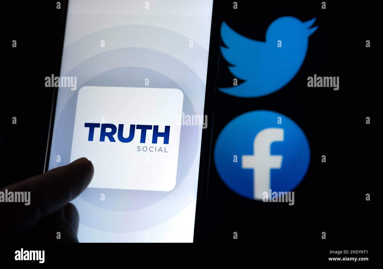 Truth Social app logo seen on the smartphone with blurred Facebook and ...