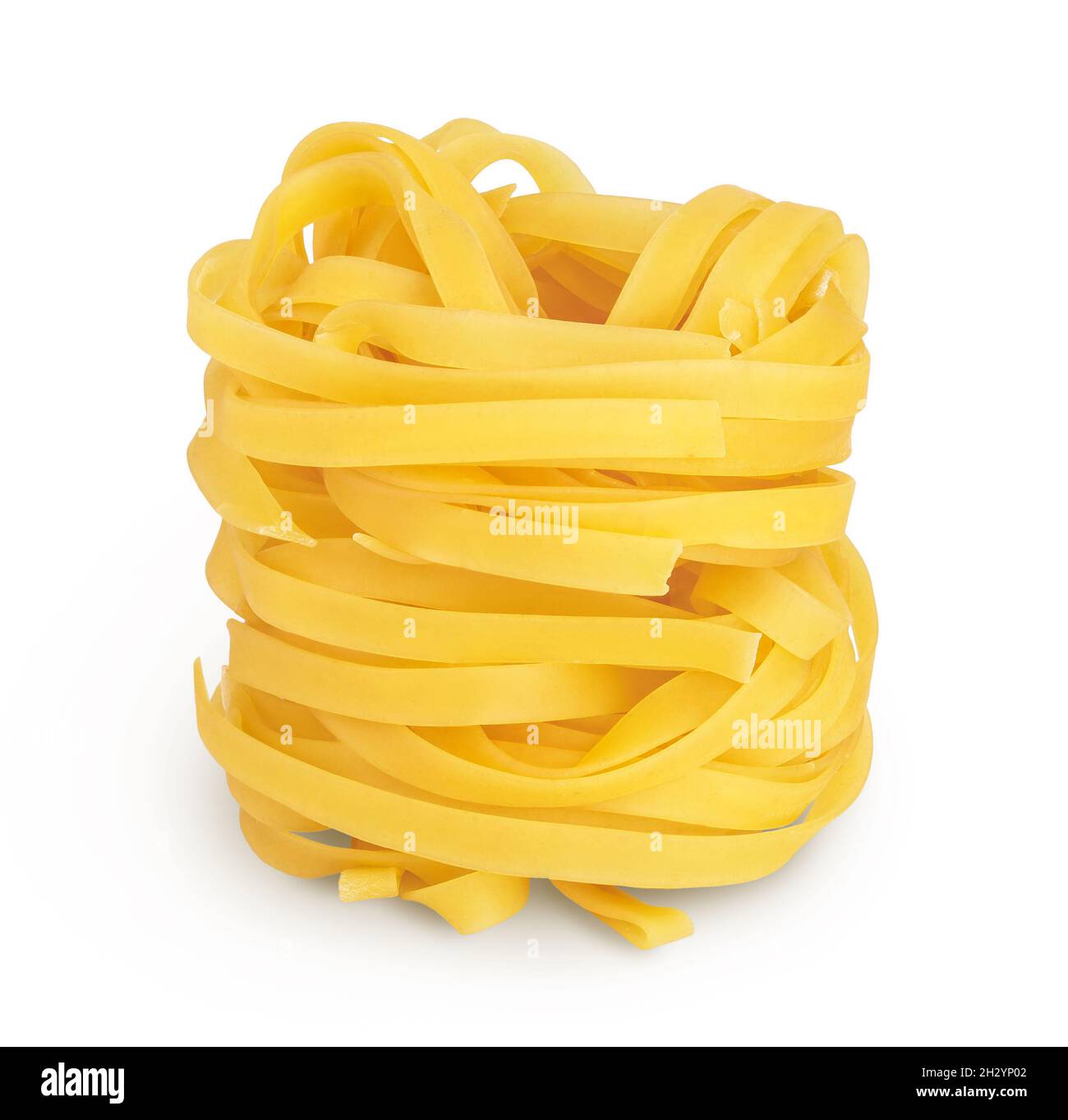 Raw tagliatelle pasta isolated on white background with clipping path ...