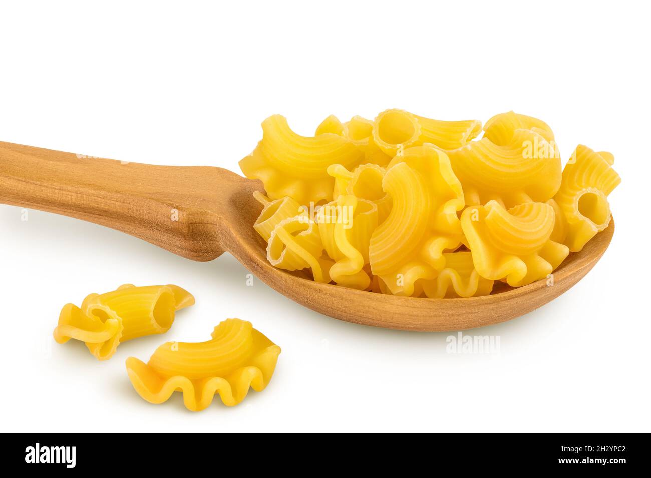 Pasta cornetti creste macaroni in wooden spoon isolated on white ...