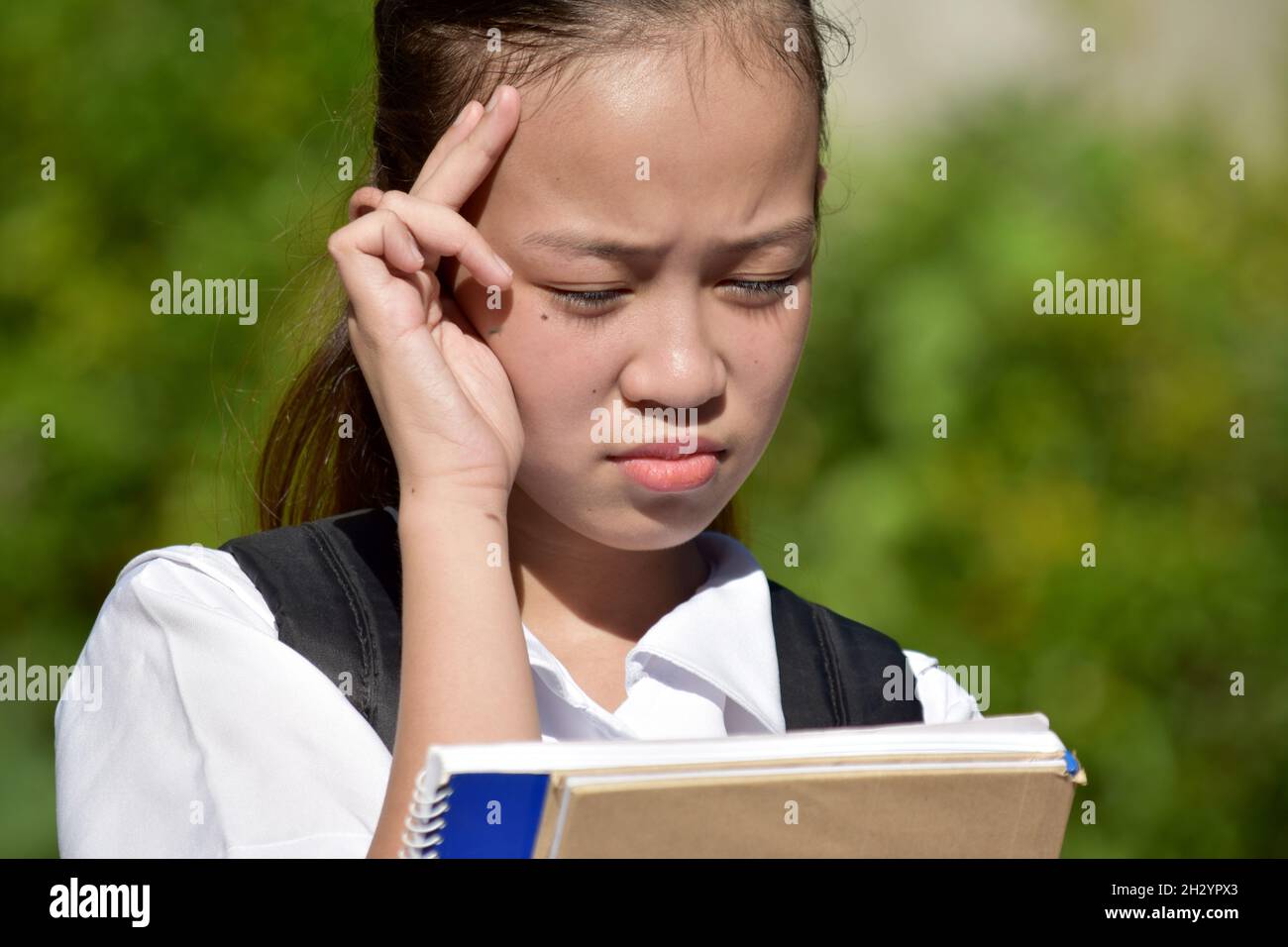 An Anxious Cute Filipina Girl Student Stock Photo - Alamy