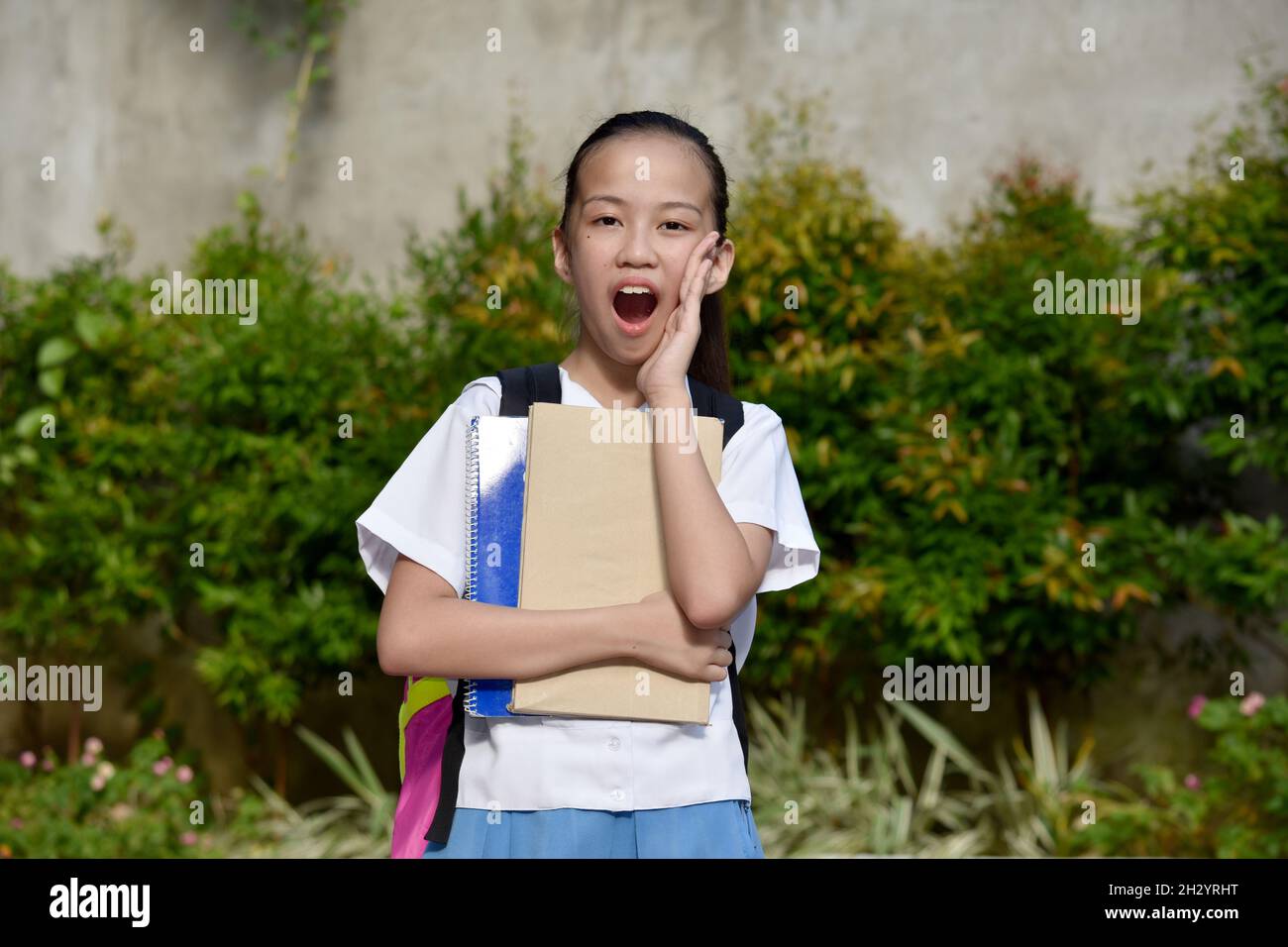 Surprised Filipina Girl Student Wearing Uniform With Books Stock Photo ...