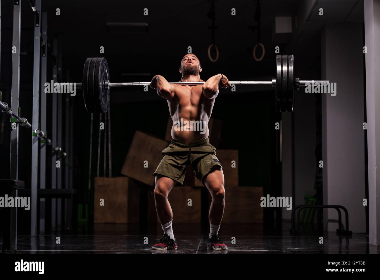 Muscular athlete lifting very heavy barbell Stock Photo - Alamy