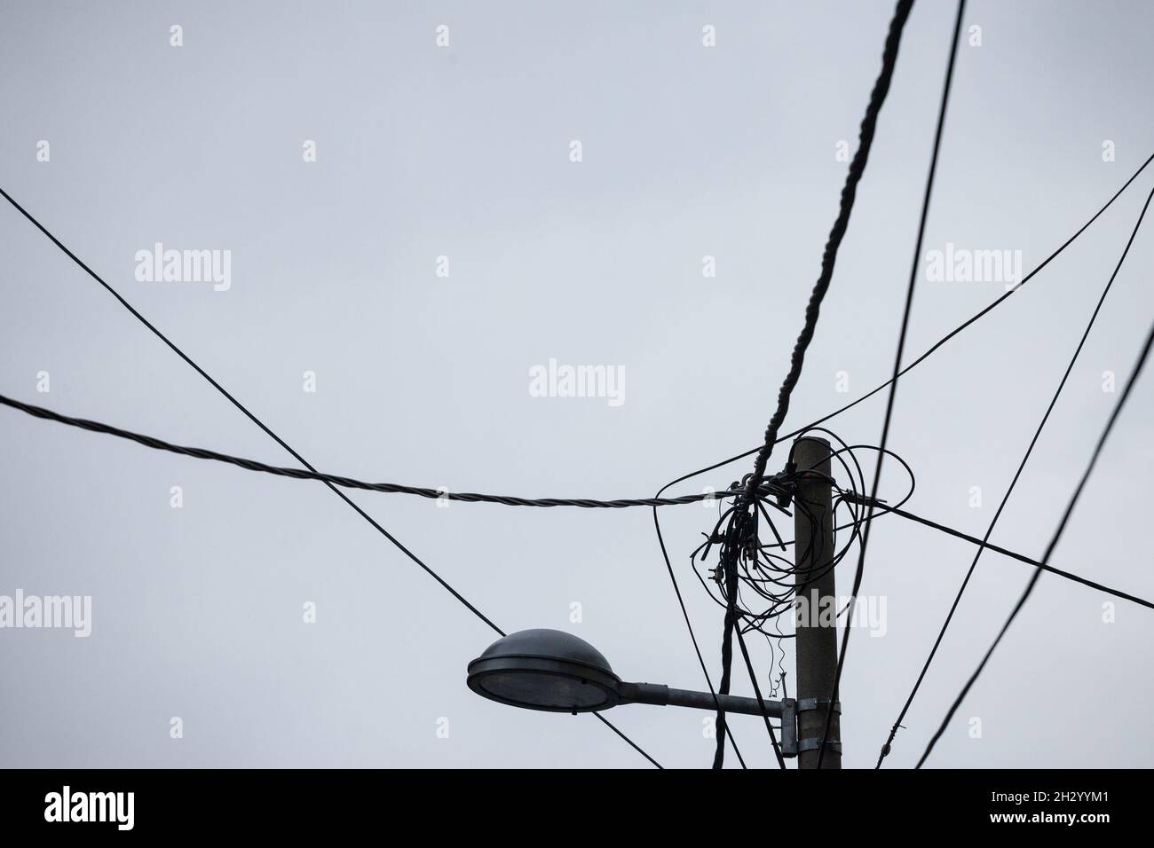 Picture of a messy power line connection with a lot of cables going ...