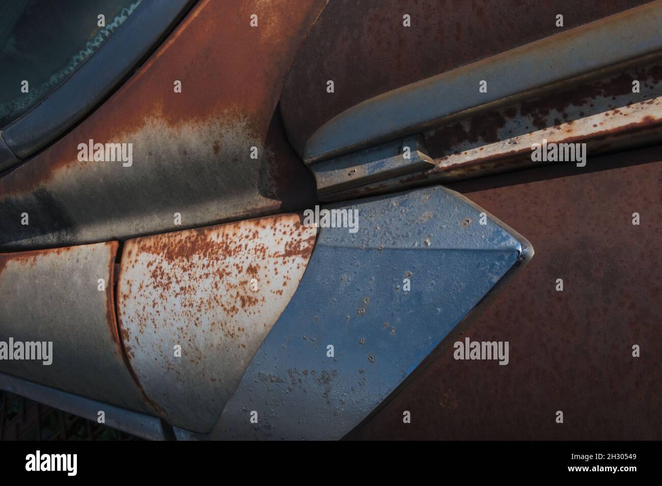 Close up of part of side of rusted American car with chrome parts Stock ...