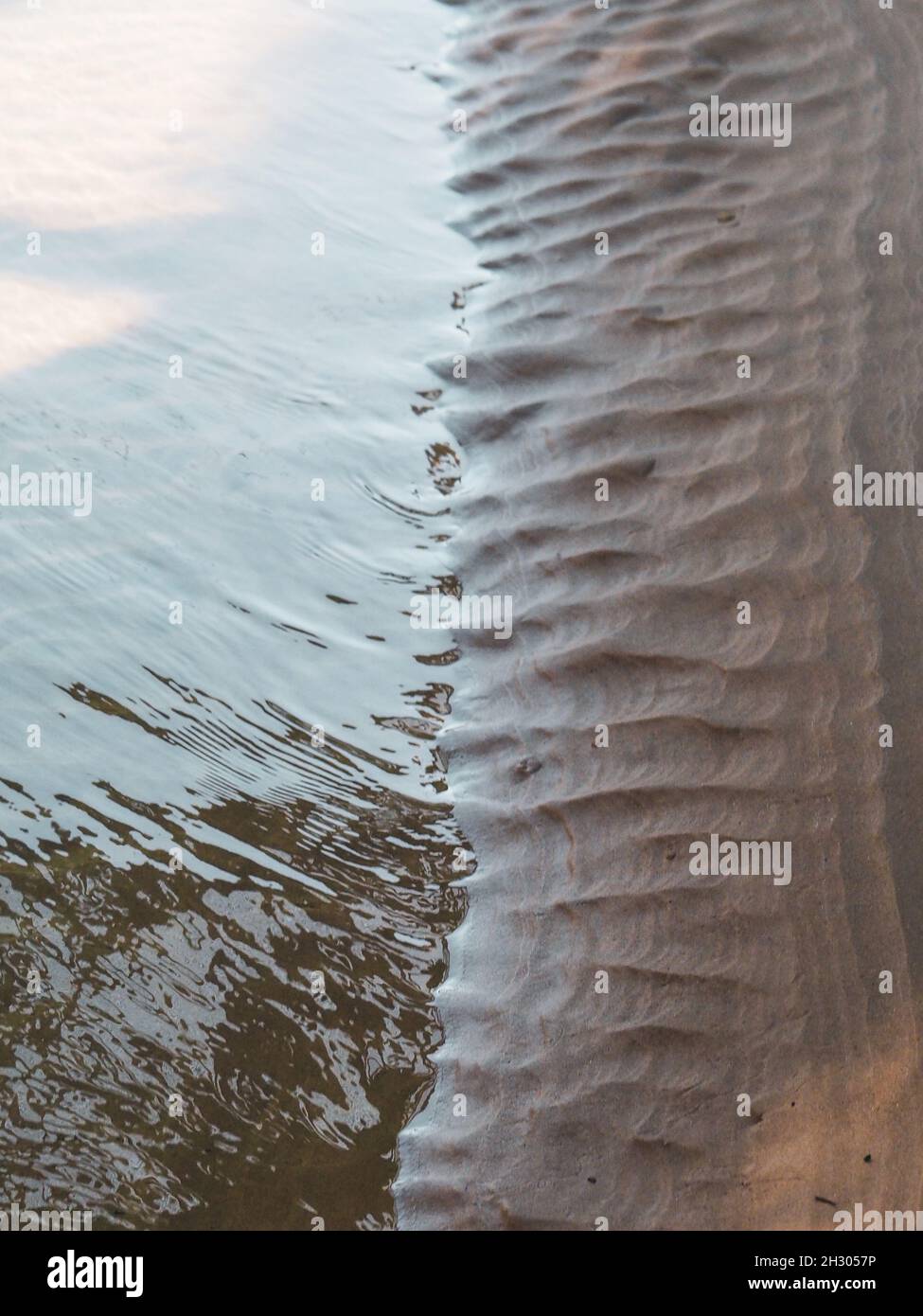 Natural patterns in the sand. Ripples and lines forming ridges and ...