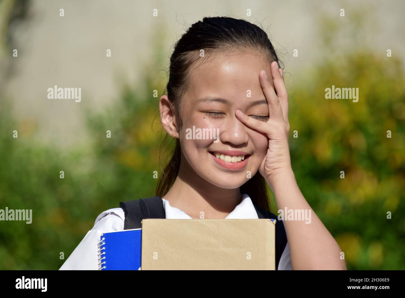 Excited asian student laughing hi-res stock photography and images - Alamy