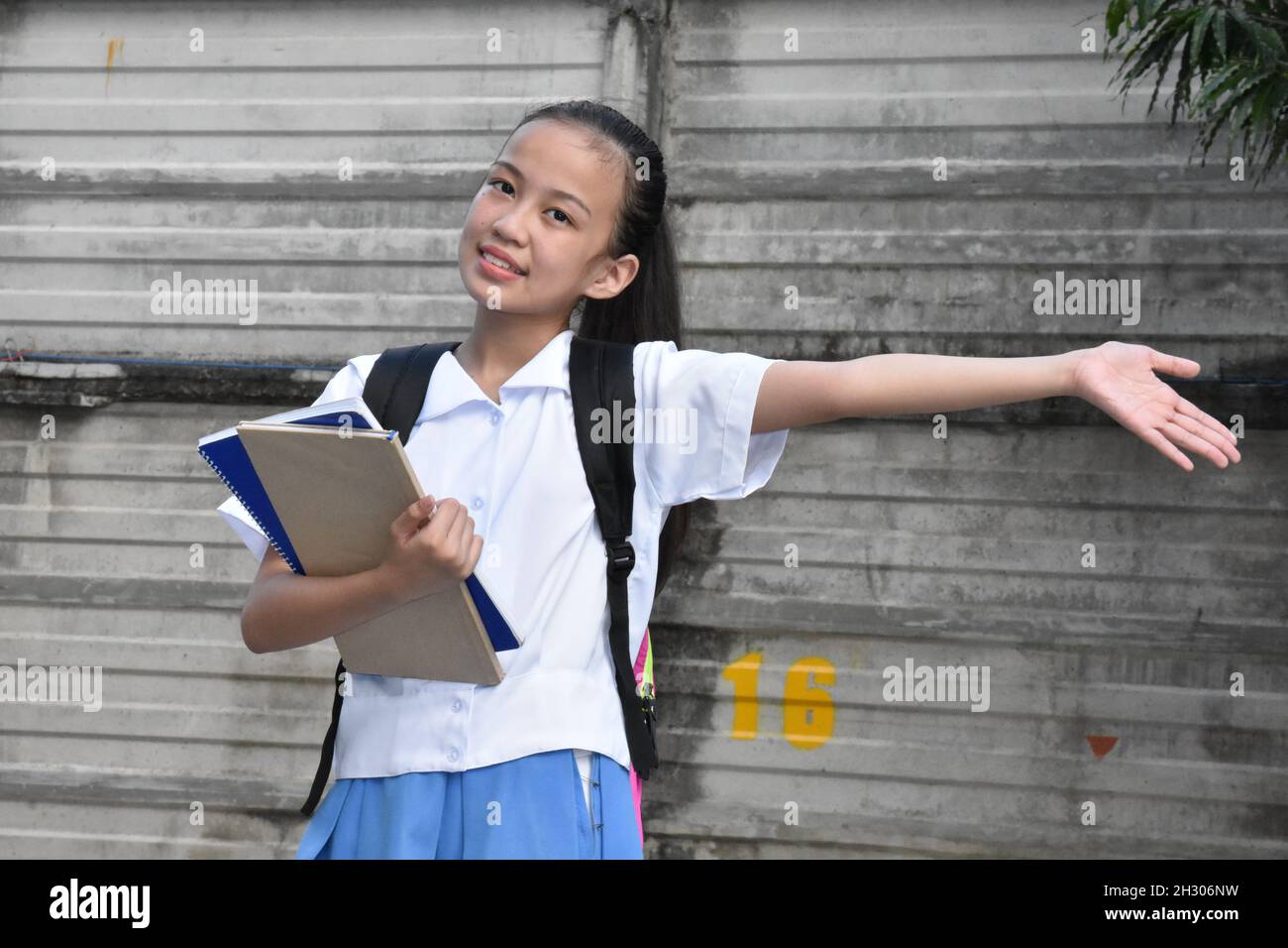 Female Student And Confidence Wearing School Uniform Stock Photo - Alamy
