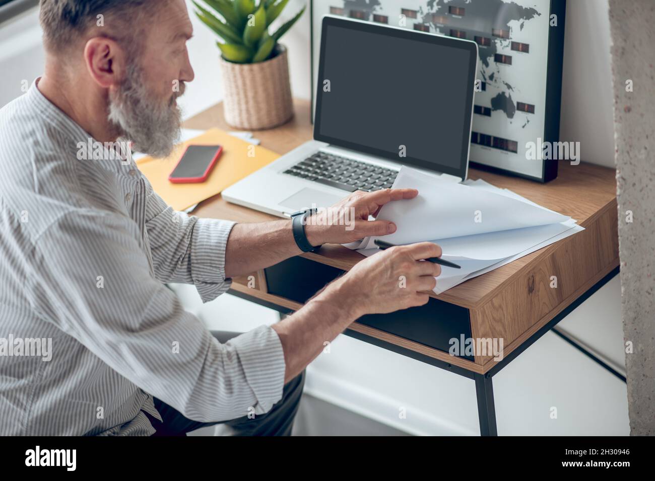 Bearded man working documents hi-res stock photography and images - Alamy