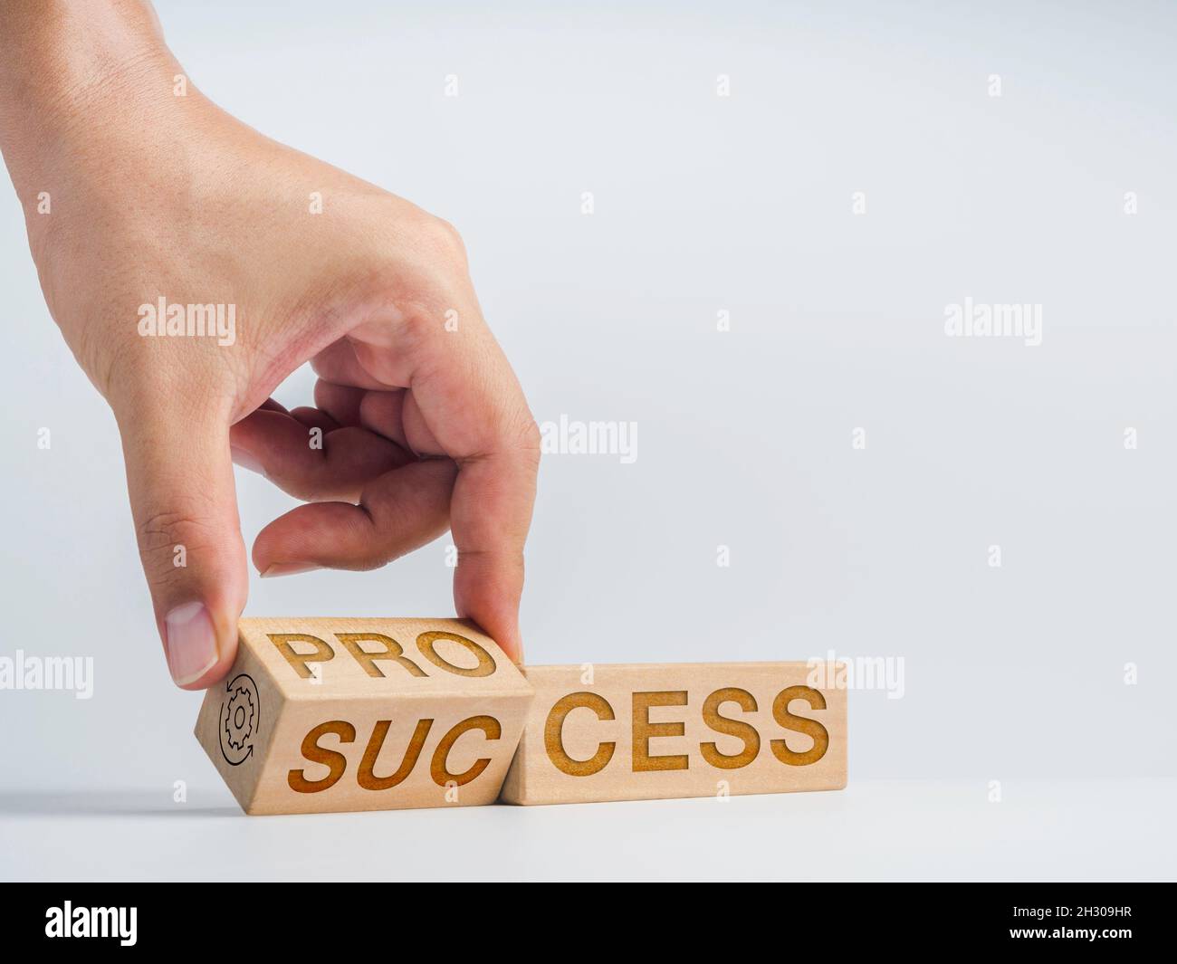 Process for success concept. Hand turning wooden cube block to change ...