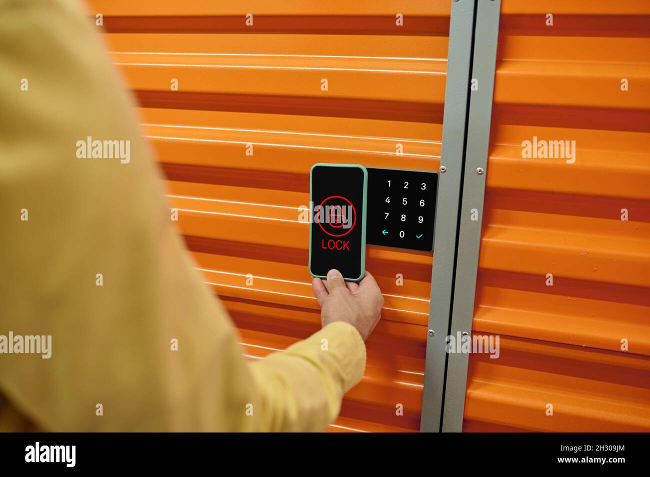 A warehouse worker testing the digital management system Stock Photo ...