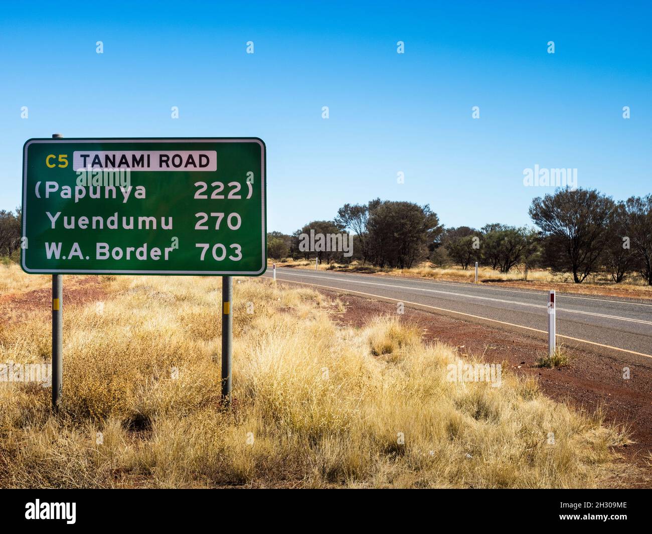 Distance sign on the sealed section of Tanami Road near Alice Springs ...