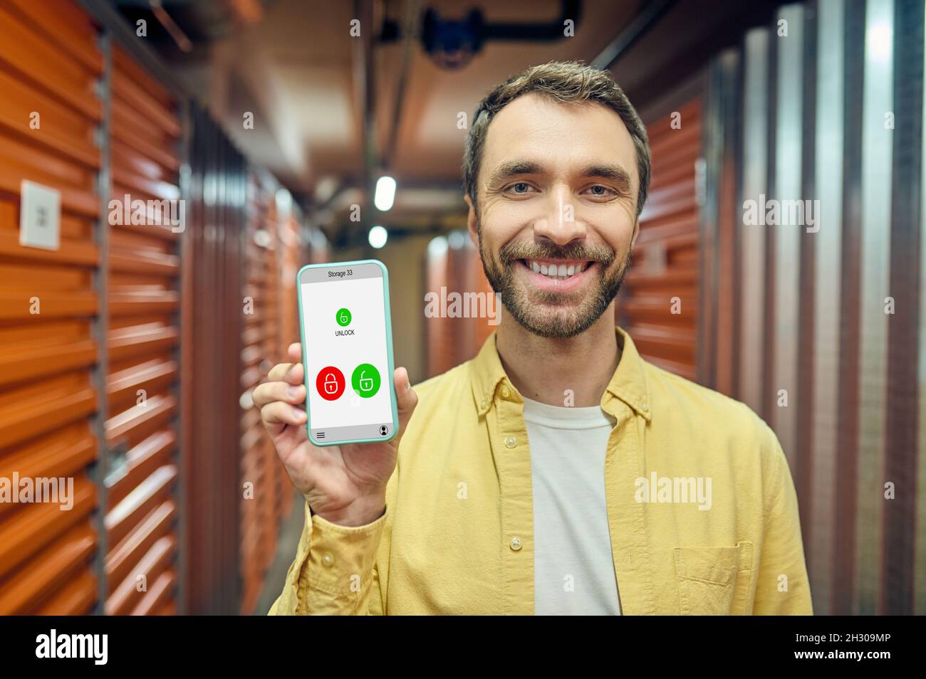 Man showing smartphone screen with running program Stock Photo - Alamy