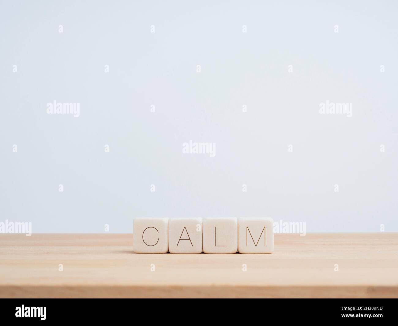 Stay calm concept. Words, "CALM" with modern thin font on white dice ...