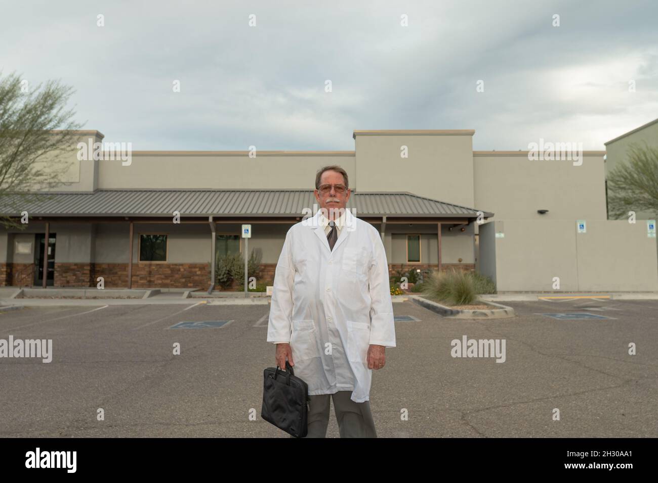 Male practitioner in white hi-res stock photography and images - Alamy