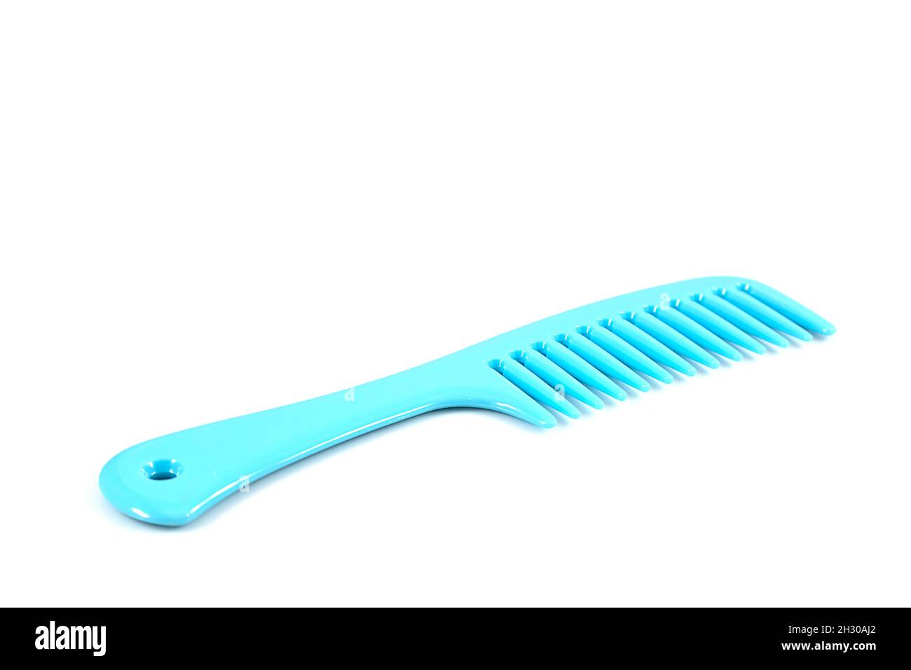 blue plastic comb isolated on white background Stock Photo - Alamy