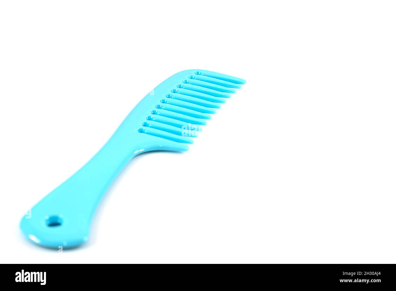 blue plastic comb isolated on white background Stock Photo - Alamy