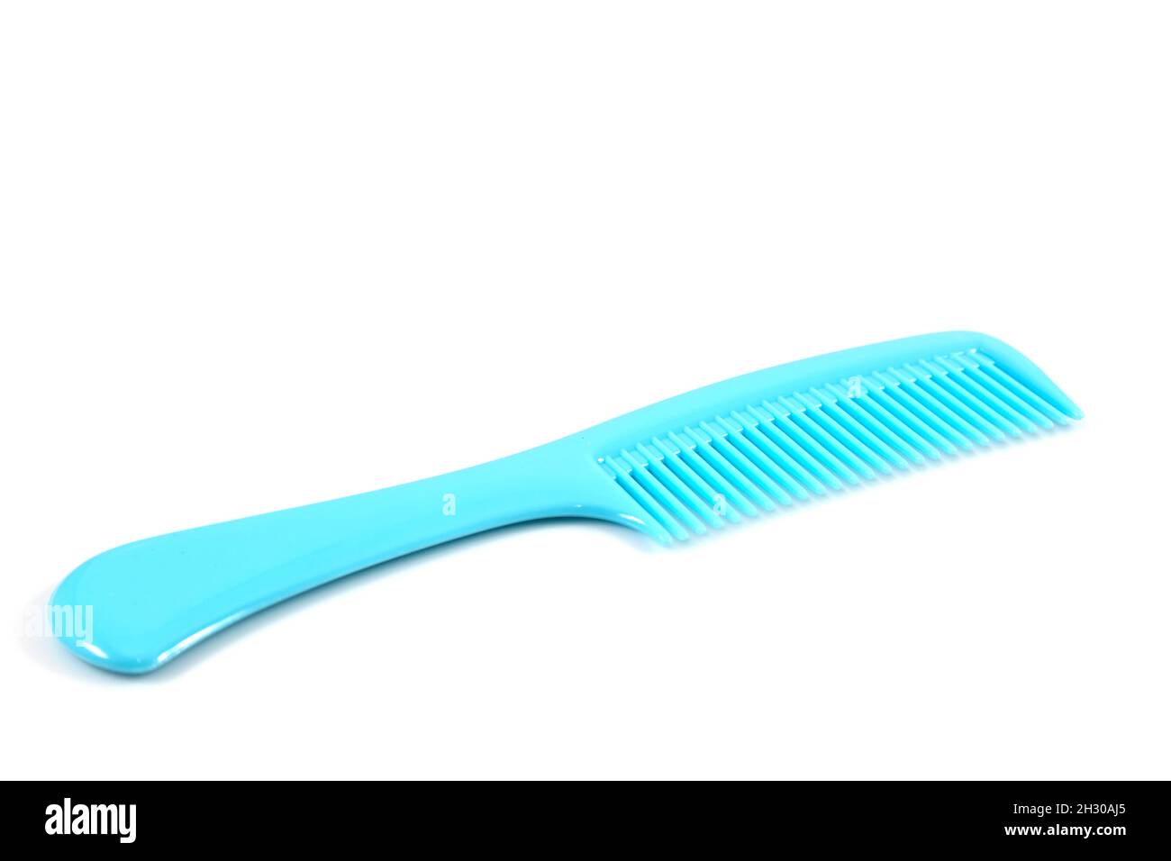 blue plastic comb isolated on white background Stock Photo - Alamy