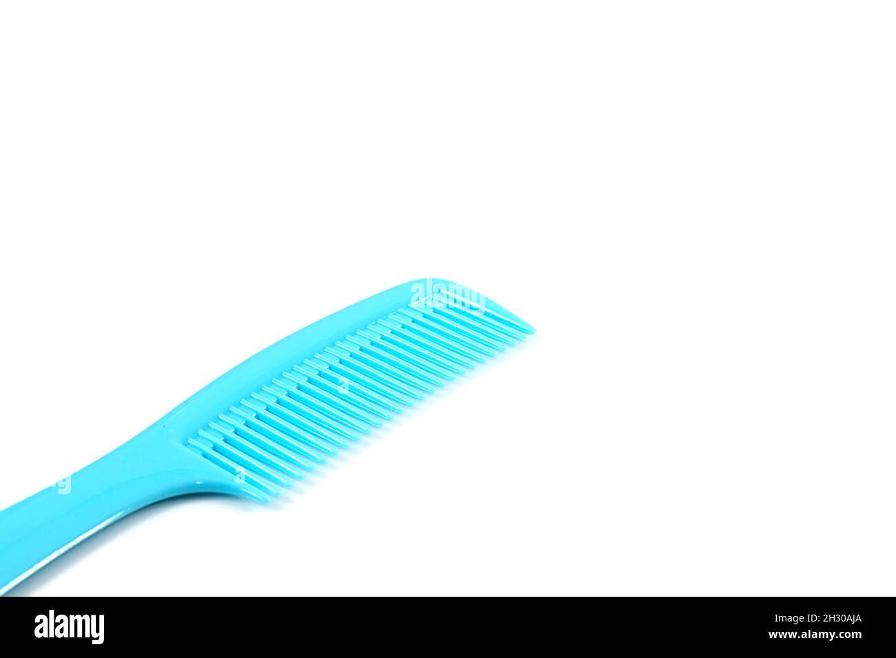 blue plastic comb isolated on white background Stock Photo - Alamy