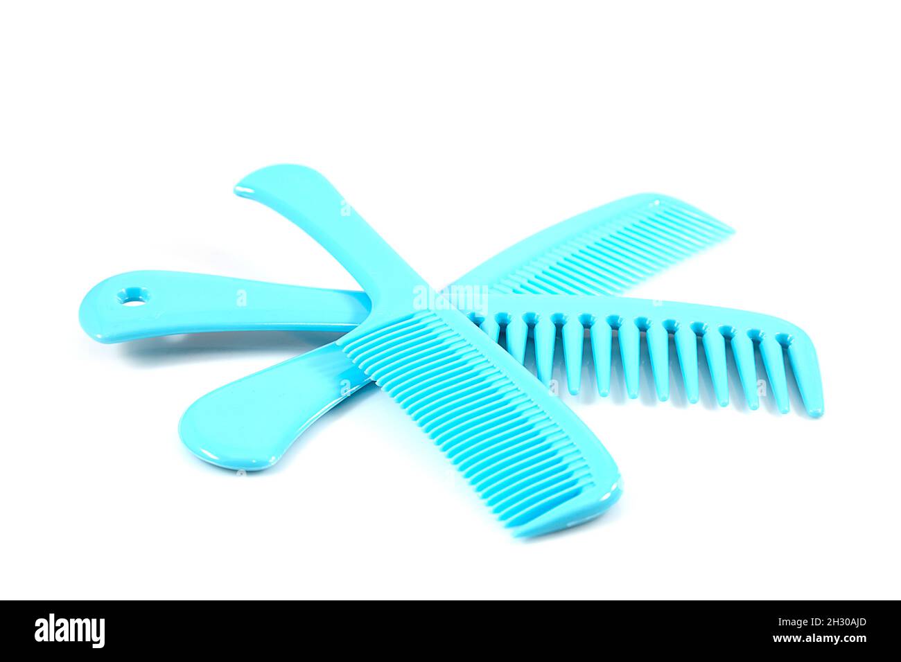 Set of blue plastic comb isolated on white background Stock Photo - Alamy