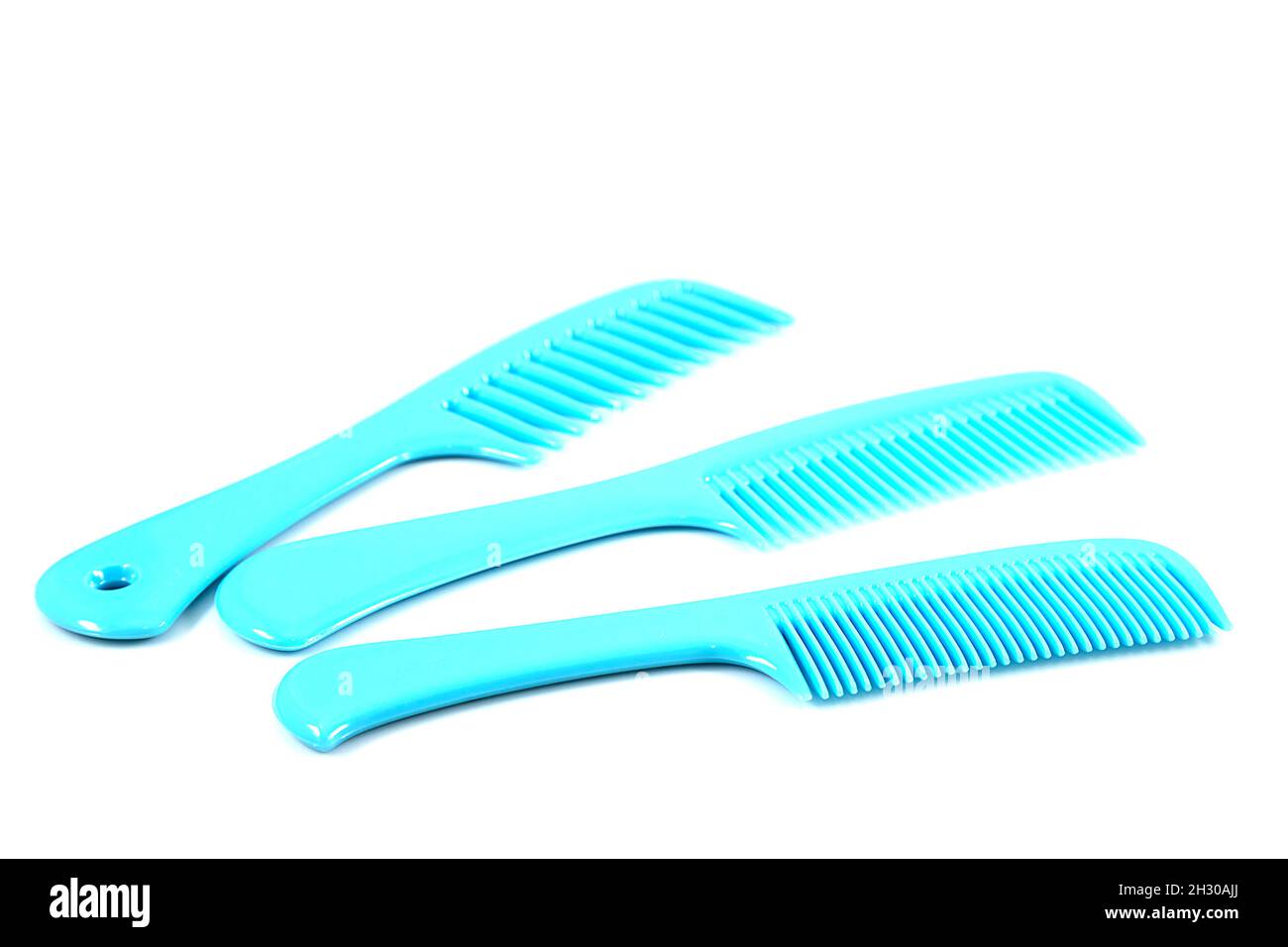 Set of blue plastic comb isolated on white background Stock Photo - Alamy