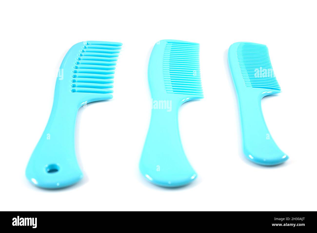Set of blue plastic comb isolated on white background Stock Photo - Alamy