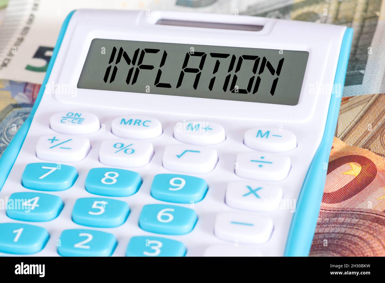Calculator, euro banknotes and inflation in Europe Stock Photo - Alamy