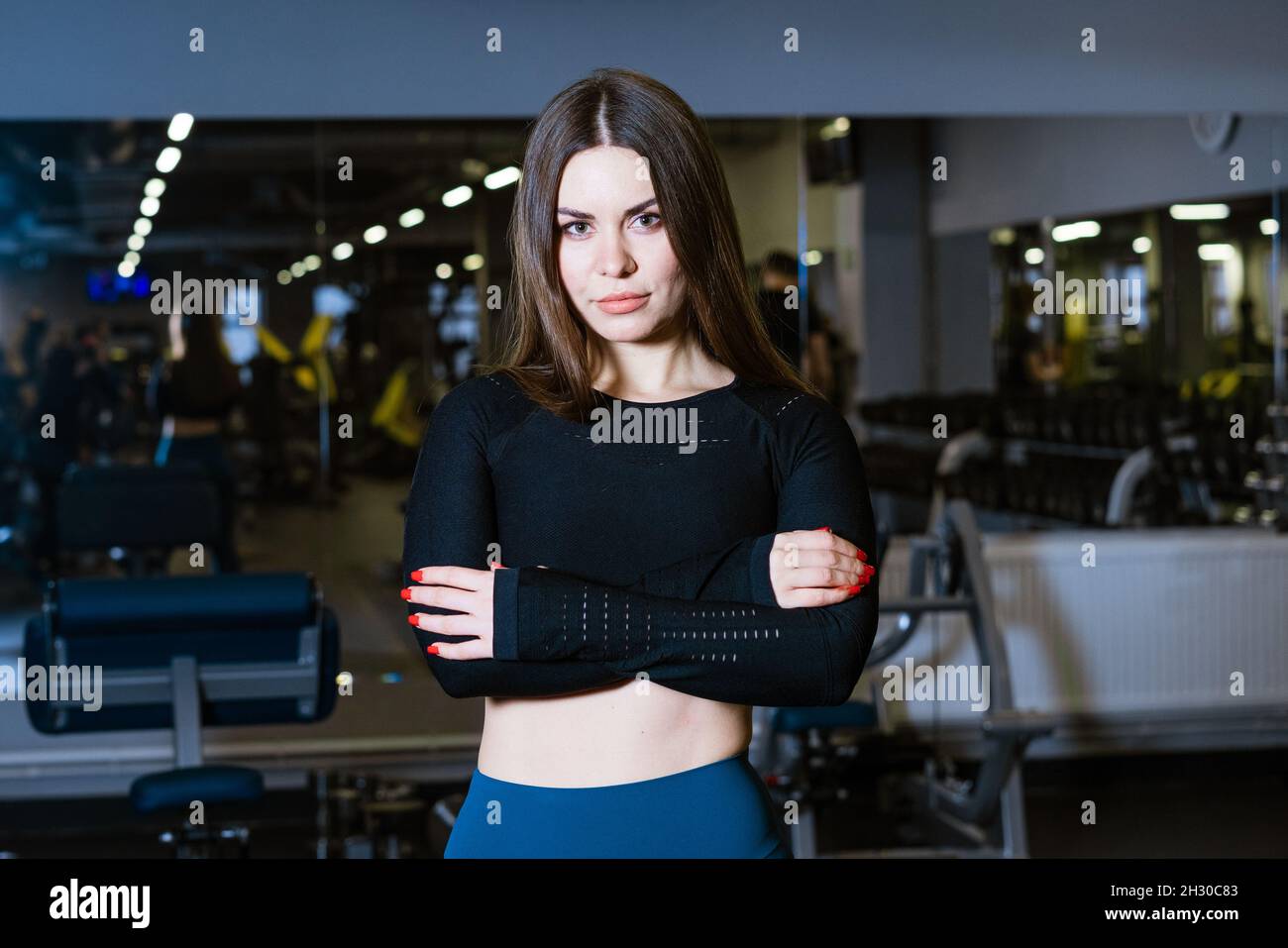 Woman warm up exercise in fitness gym, after sport workout with ...