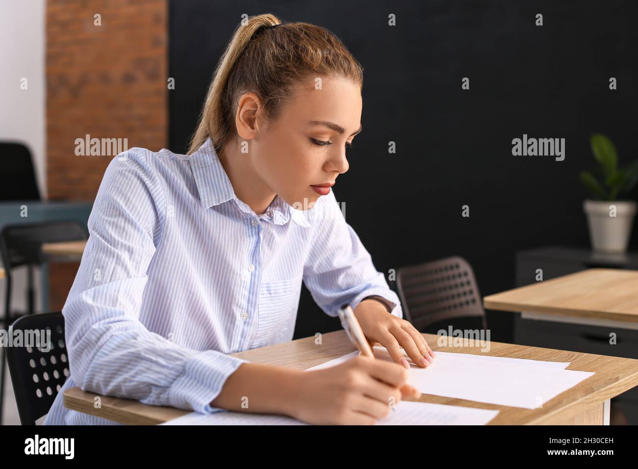 Student passing exam at school Stock Photo - Alamy