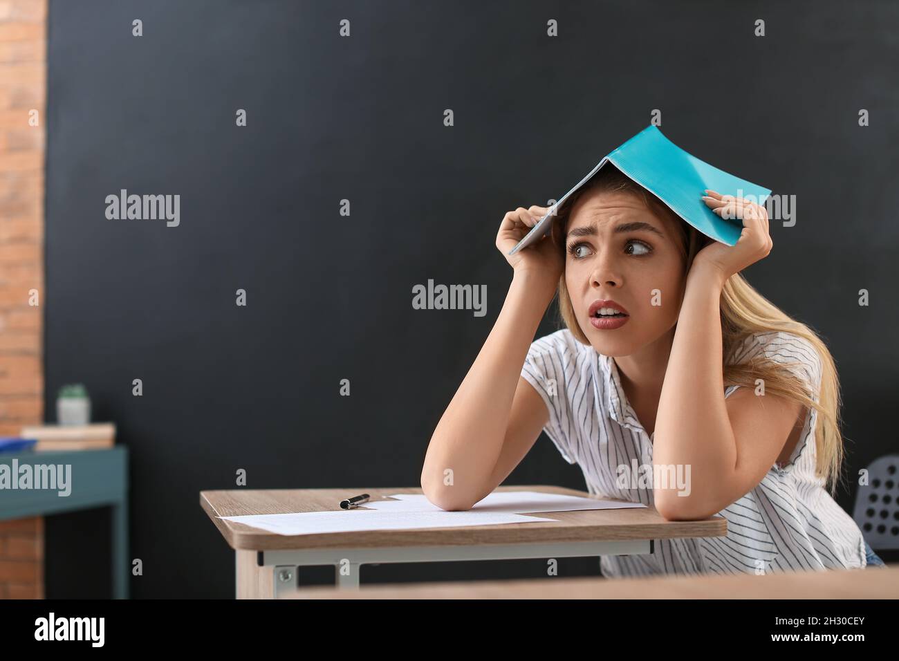 Student passing difficult exam at school Stock Photo - Alamy