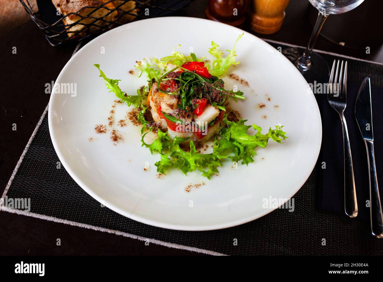 Cod timbale with baked red pepper, rocket and olive tapenade Stock ...