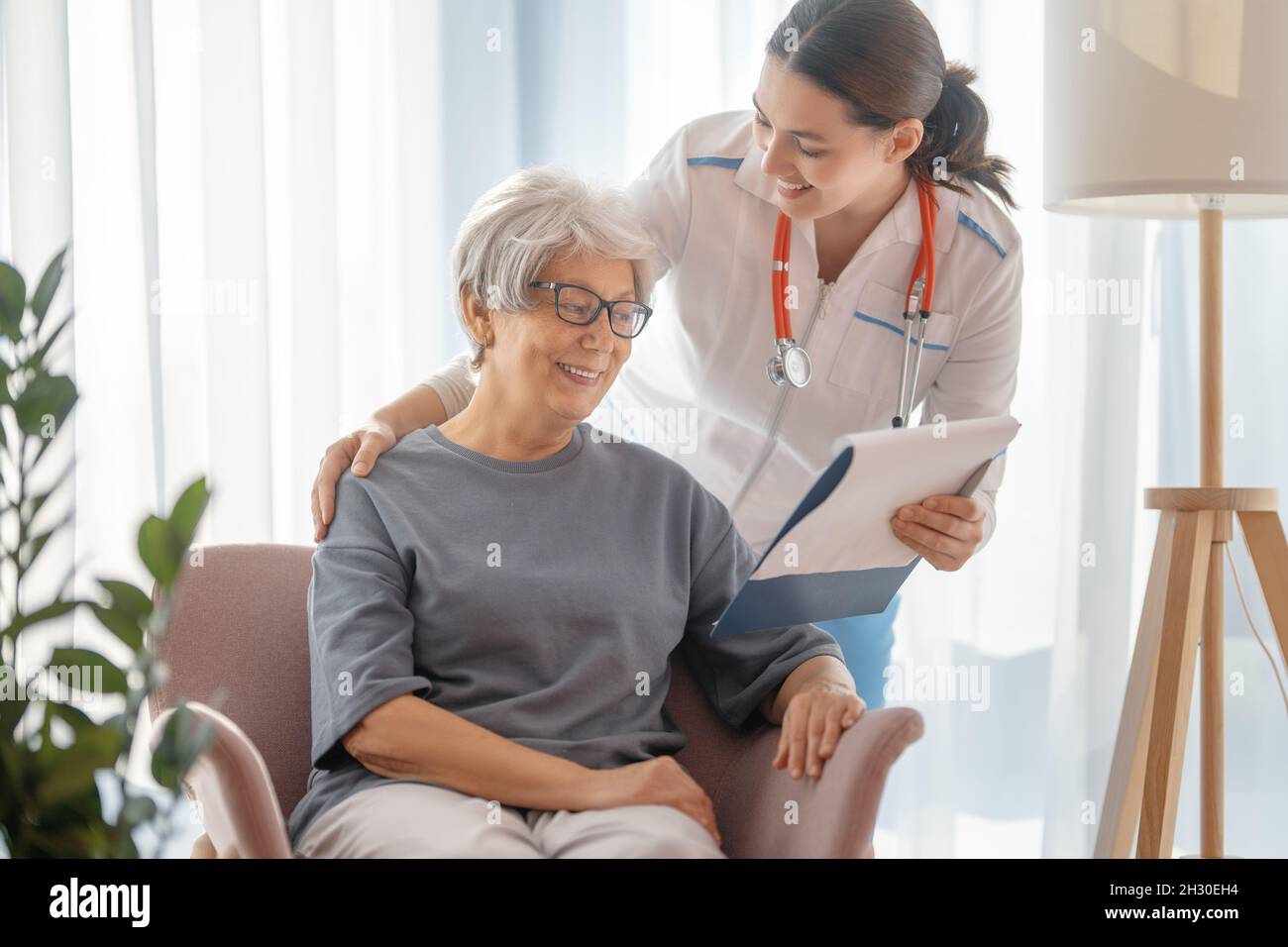 Female patient listening to a doctor in hospital Stock Photo - Alamy
