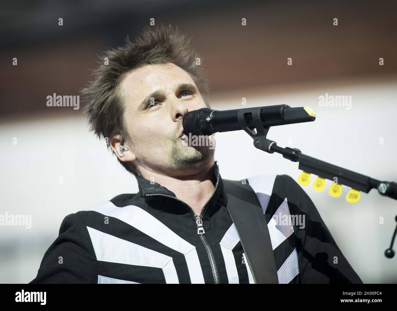 Matt Bellamy from MUSE plays live on stage at The Emirates Stadium ...