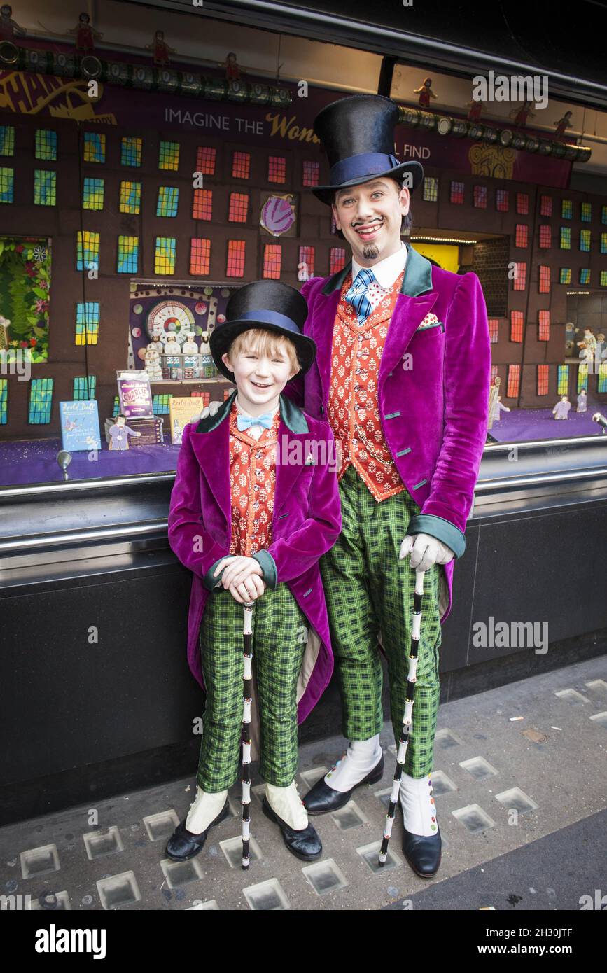 Willy Wonka (Ross Dawes) and Charlie (Troy Tipple) stand for a ...