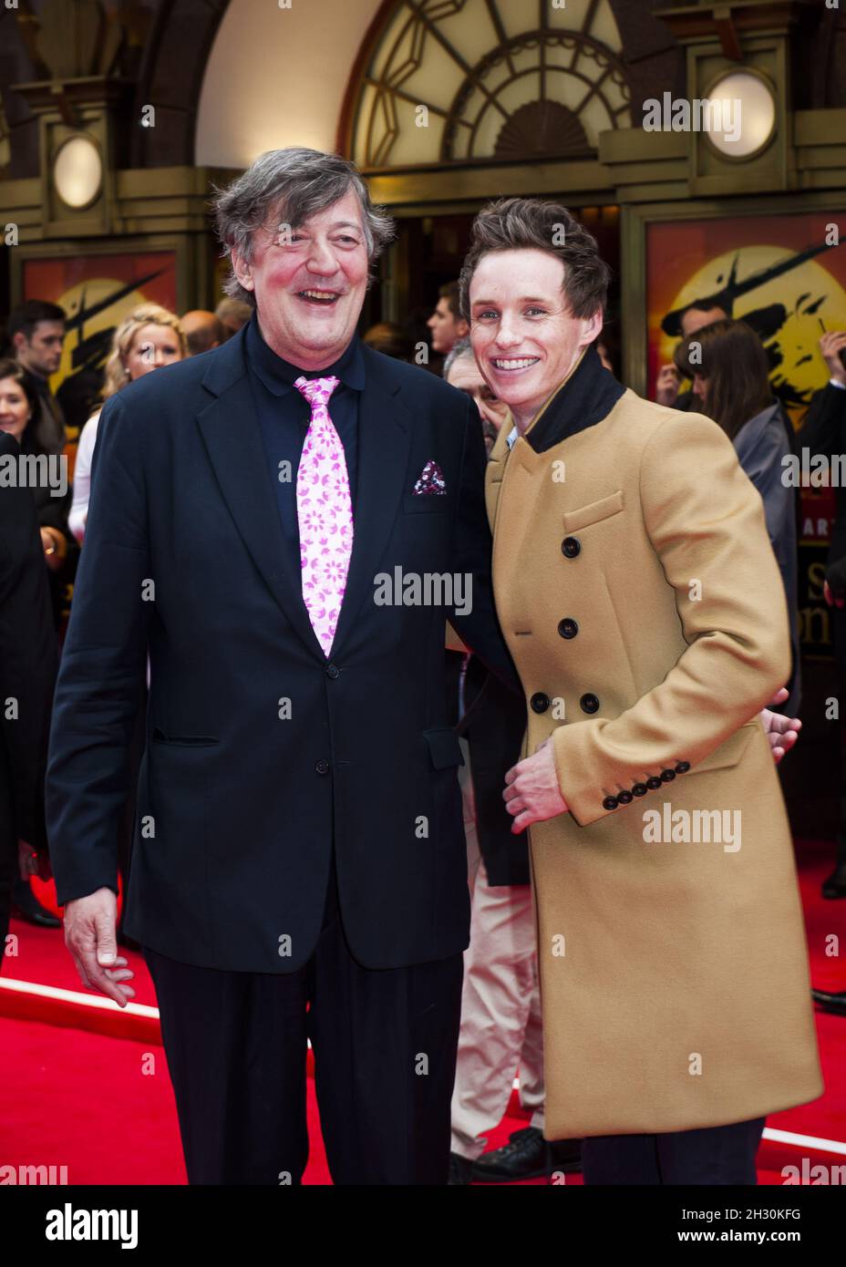 Stephen Fry and Eddie Redmayne arrive at the Miss Saigon press night ...