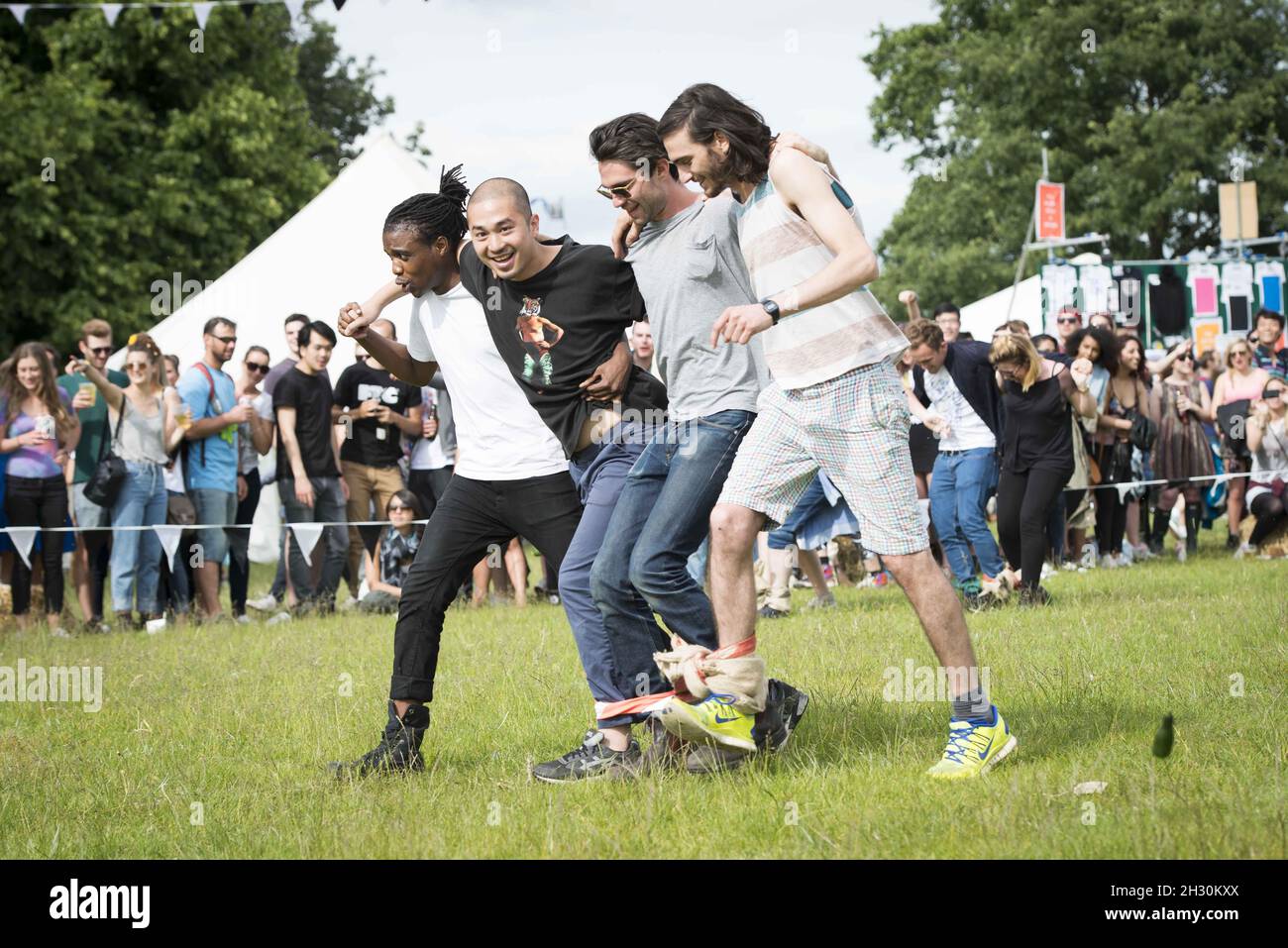 Festival goers competeing in the 5 legged race on day one of Field Day ...