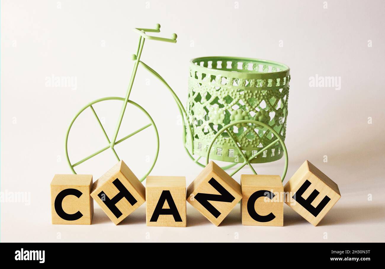 Wooden cubes with the word CHANCE, on a white background with a vintage ...