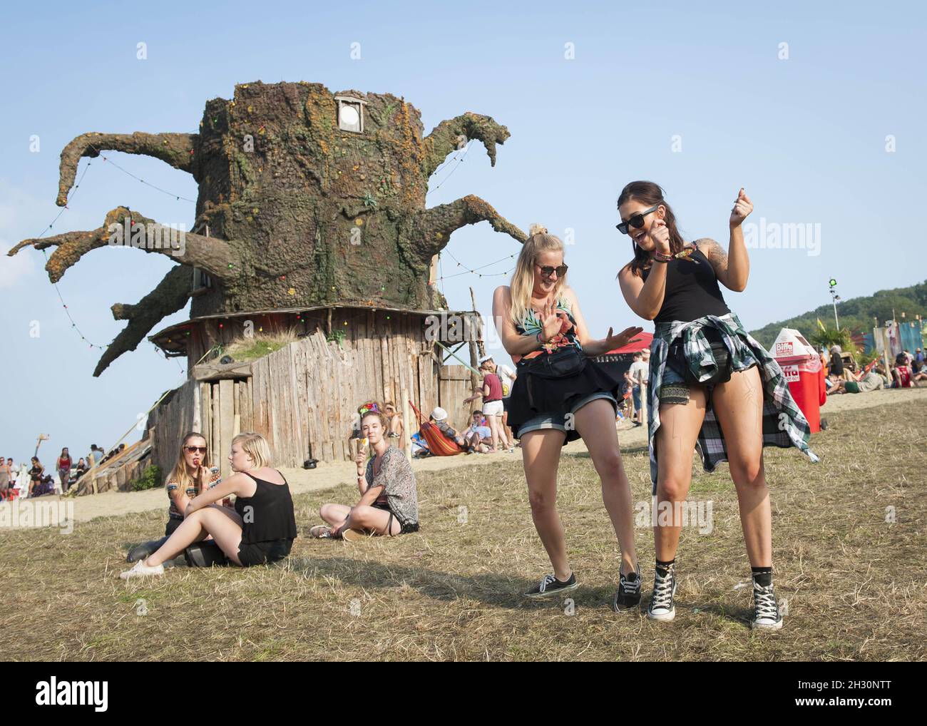 Festival goers dance in front of the wishing tree on day 4 of Bestival ...