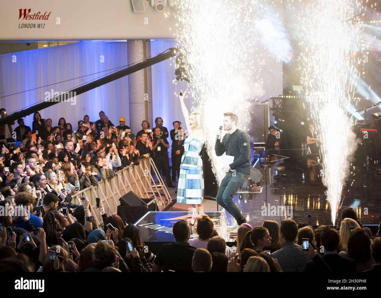 Rita Ora and Rick Edwards on stage at Westfield during the Christmas ...