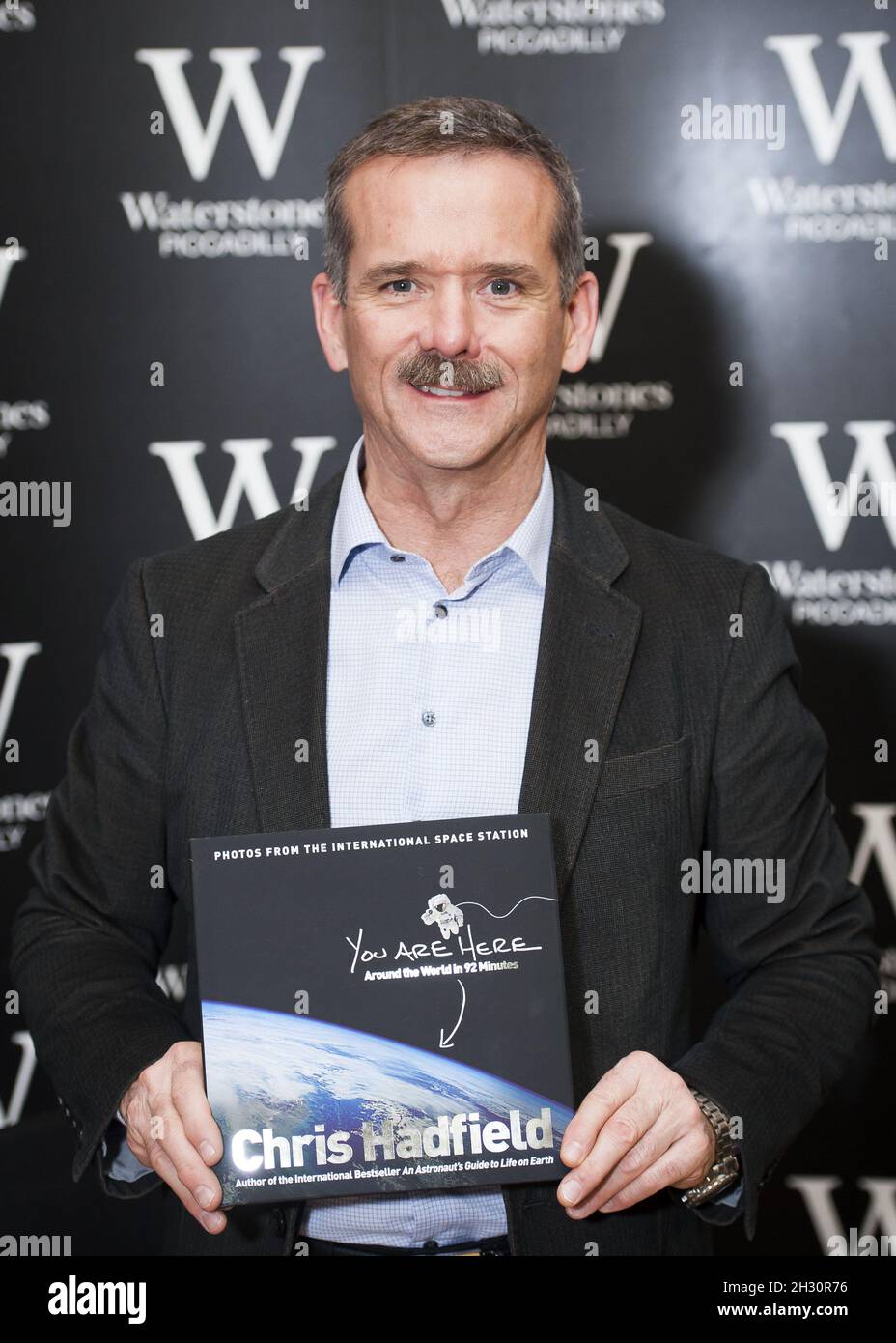 Chris Hadfield signs his book 'You Are Here' at Waterstones Picadilly ...