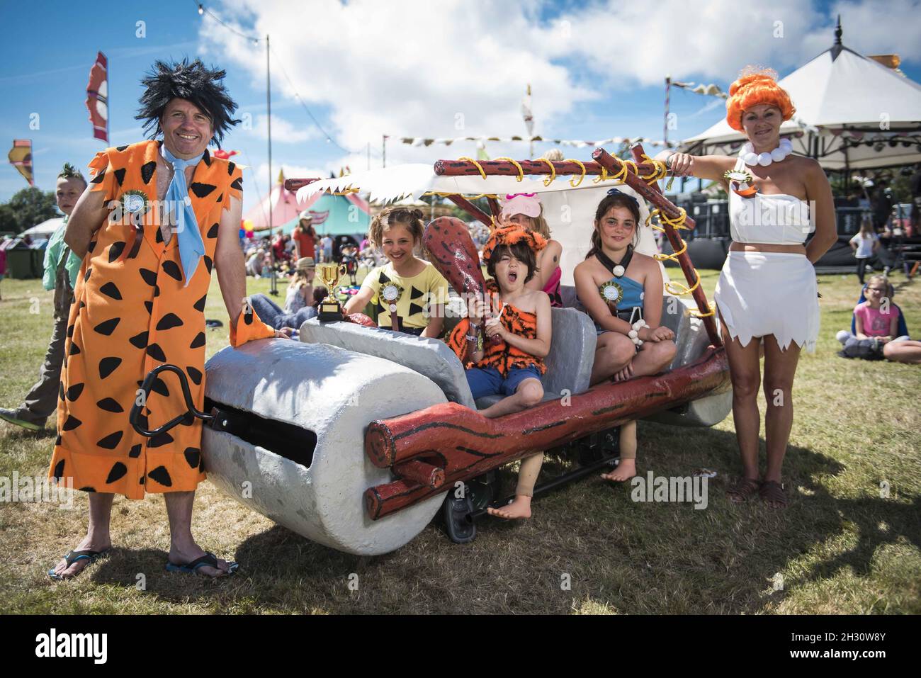 Festival goers dressed as the Flintstones on day 2 of Camp Bestival ...