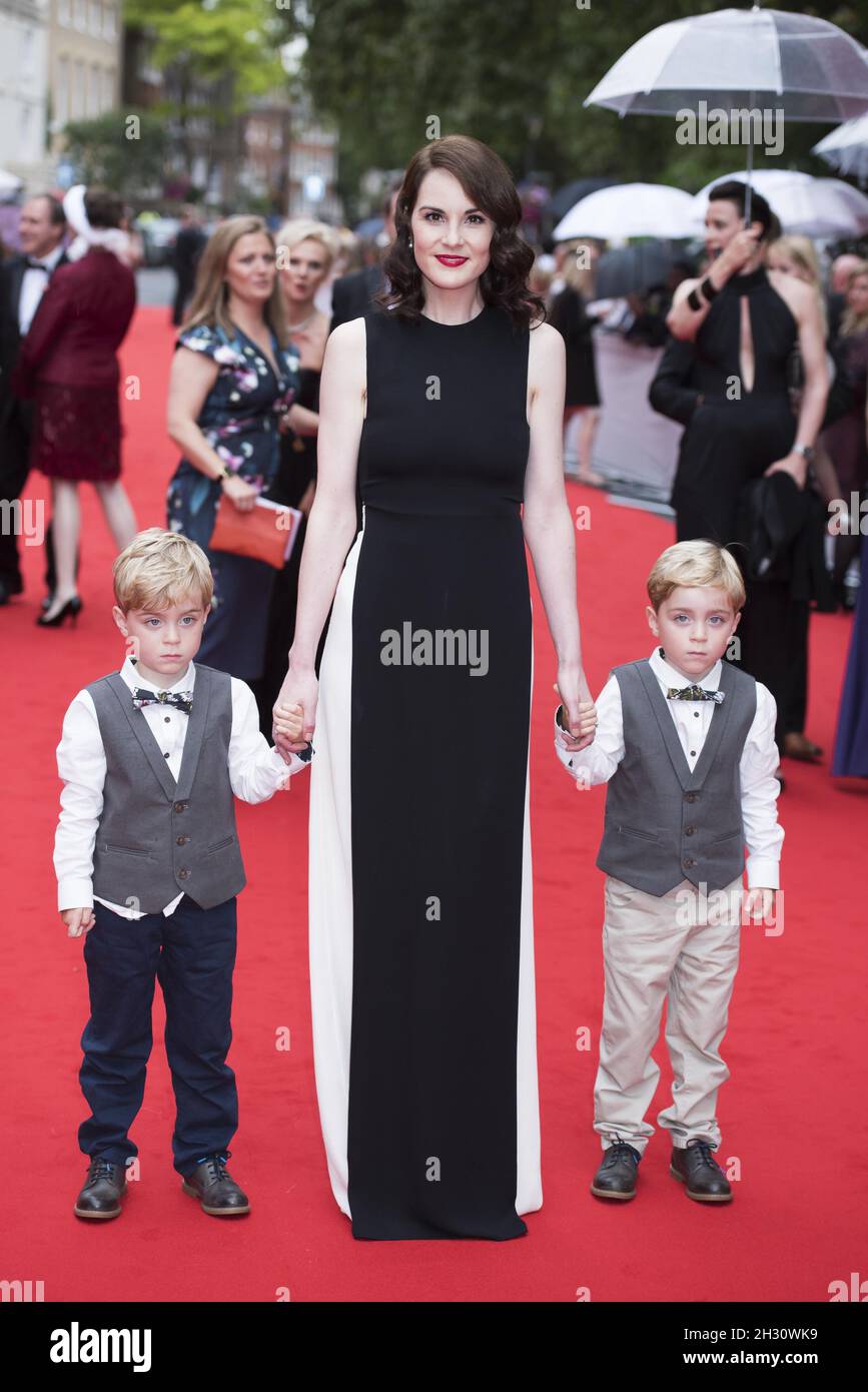 Michelle Dockery with Zac and Oliver Barker arrives at the BAFTA ...