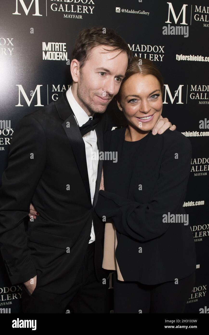 Tyler Shields and Lindsay Lohan attend the opening night of Tyler ...