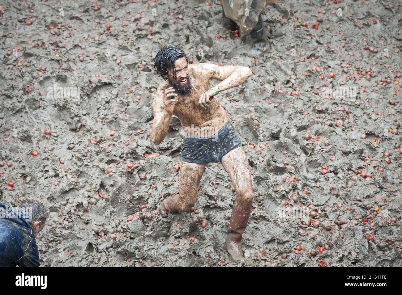 Glastonbury mud fight hi-res stock photography and images - Alamy