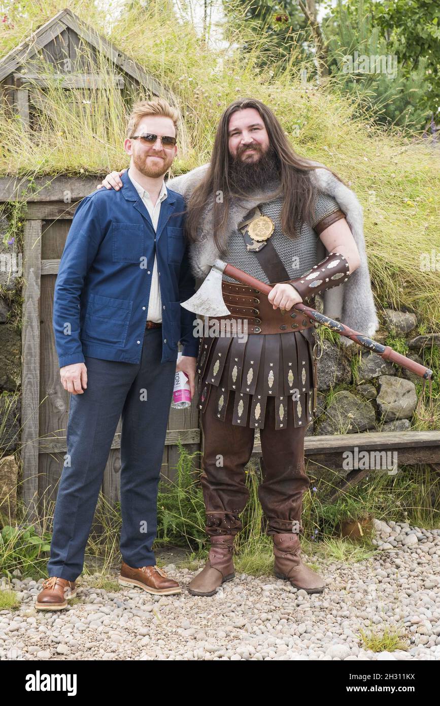 Tom Goodman-Hill with an exhibitor dressed as a Viking in the Viking ...