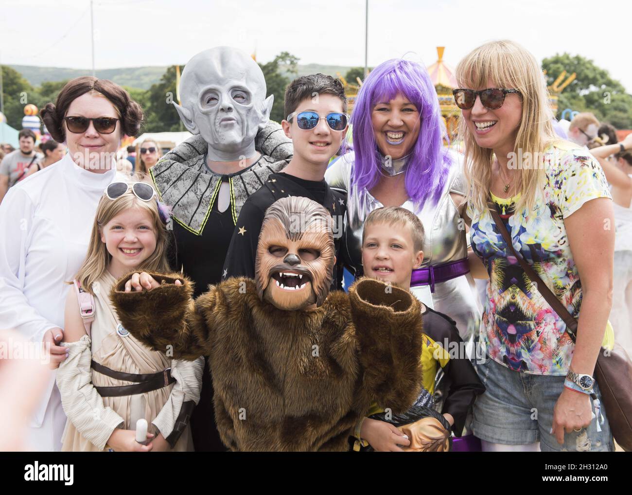 Sara Cox poses with festival goers in Space themed fancy dress at Camp ...